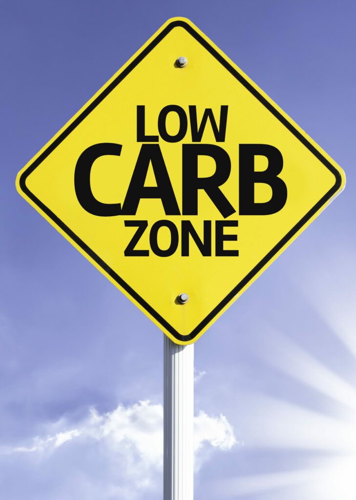Low Carb Zone road sign with sun background